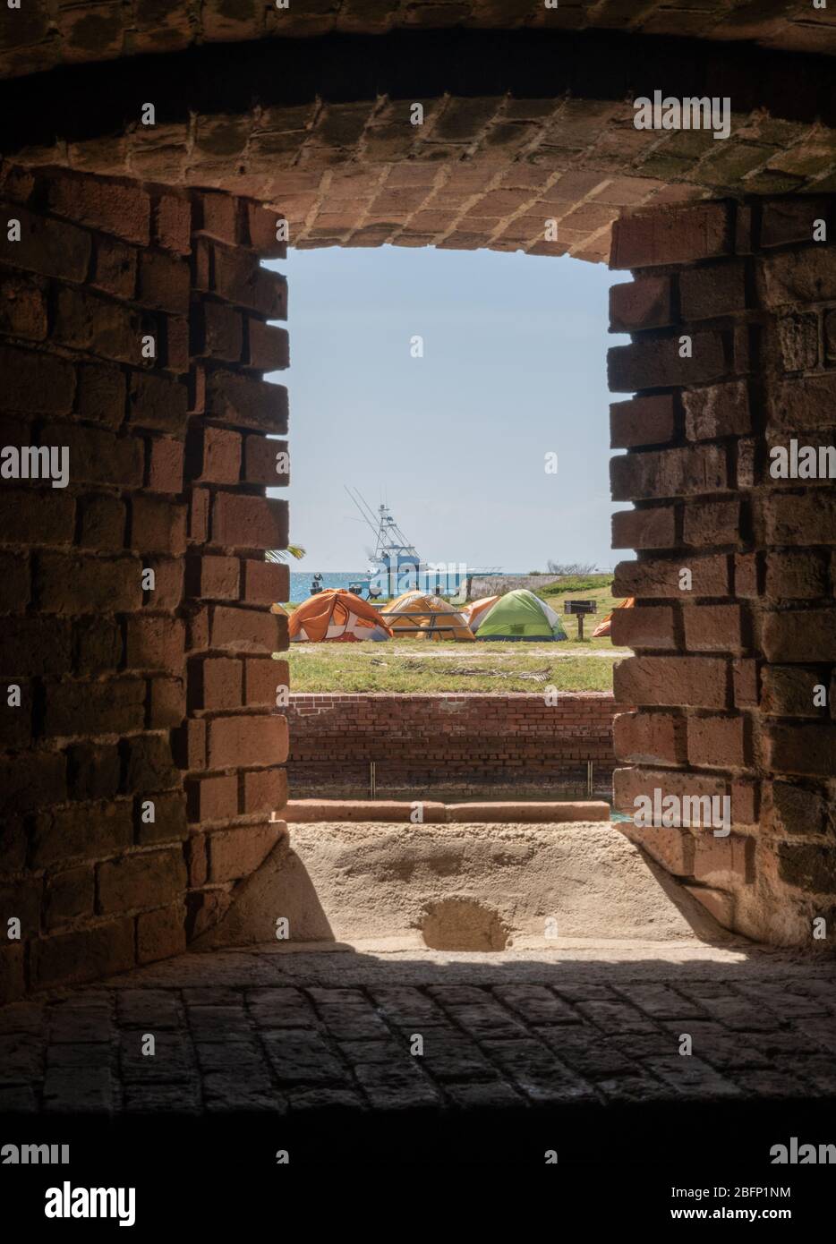 Tents and Boats Framed in Fort Window on Dry Tortugas Stock Photo - Alamy
