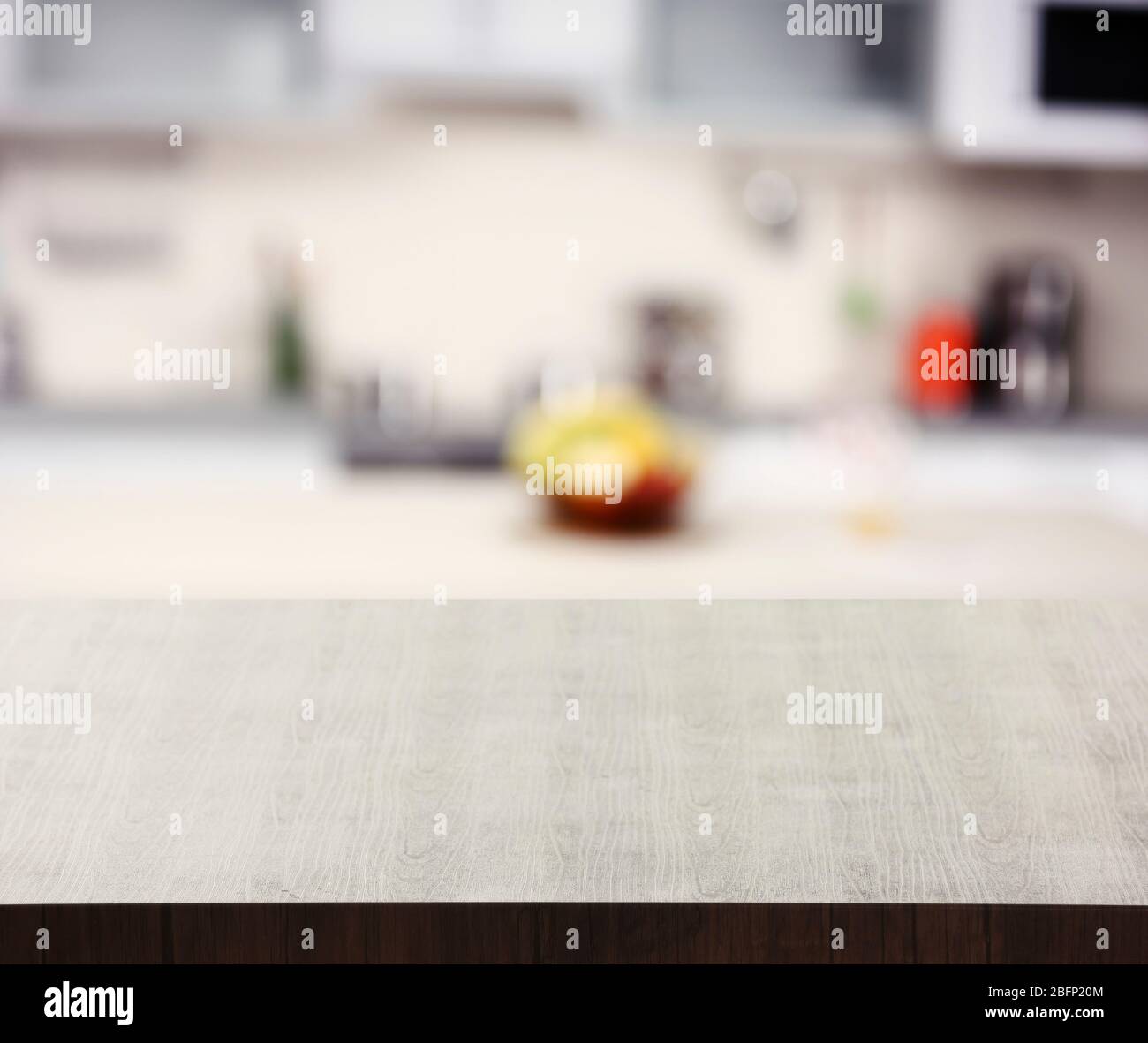 Empty wooden table and blurred kitchen background Stock Photo - Alamy