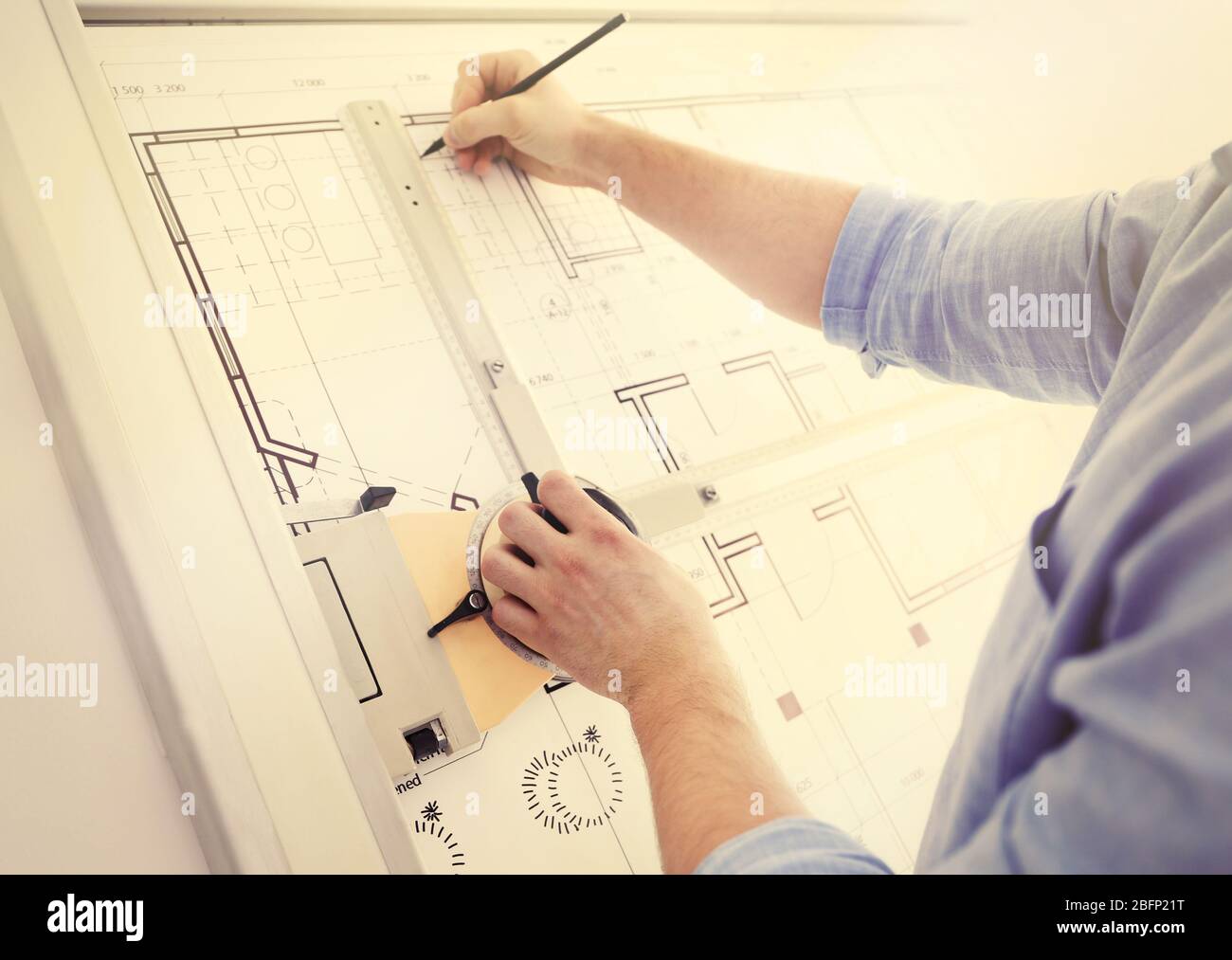 Male architects working on blueprints Stock Photo - Alamy