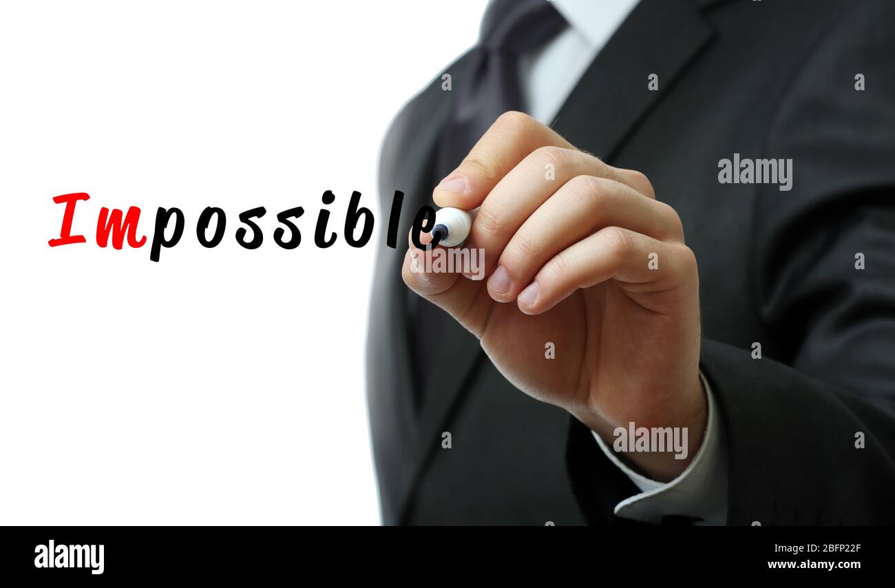 Human hand turning word impossible into possible Stock Photo - Alamy