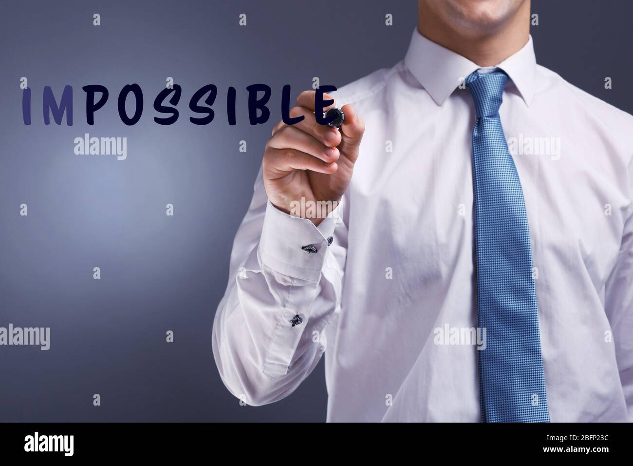 Human hand turning word impossible into possible Stock Photo - Alamy