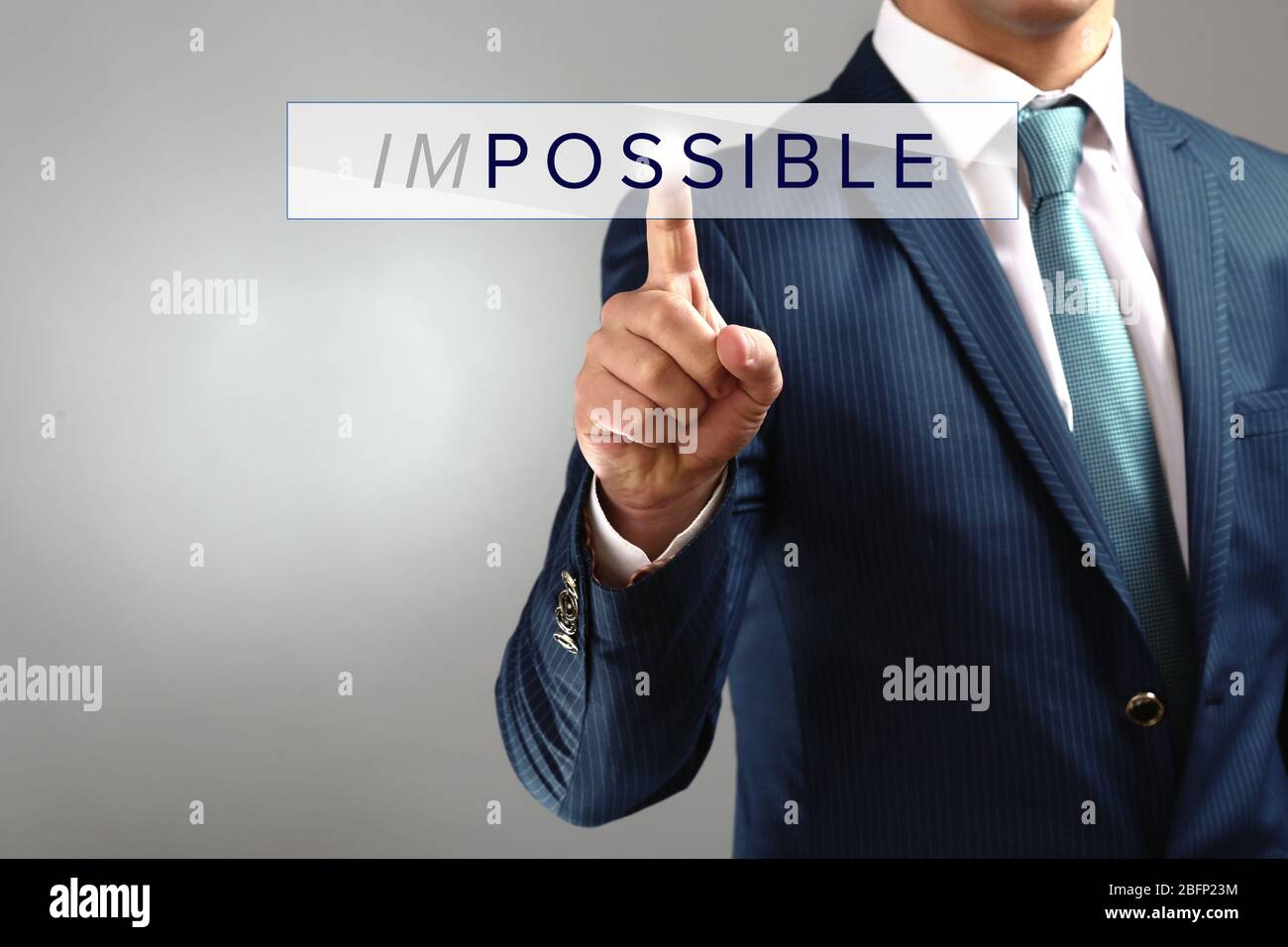 Human hand turning word impossible into possible Stock Photo - Alamy