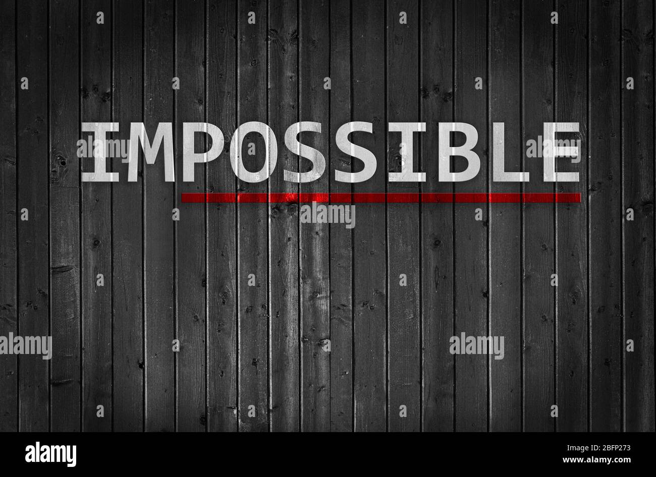 Word impossible transformed into possible on grey wall Stock Photo - Alamy