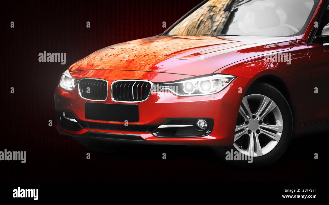 Red car isolated on black Stock Photo - Alamy