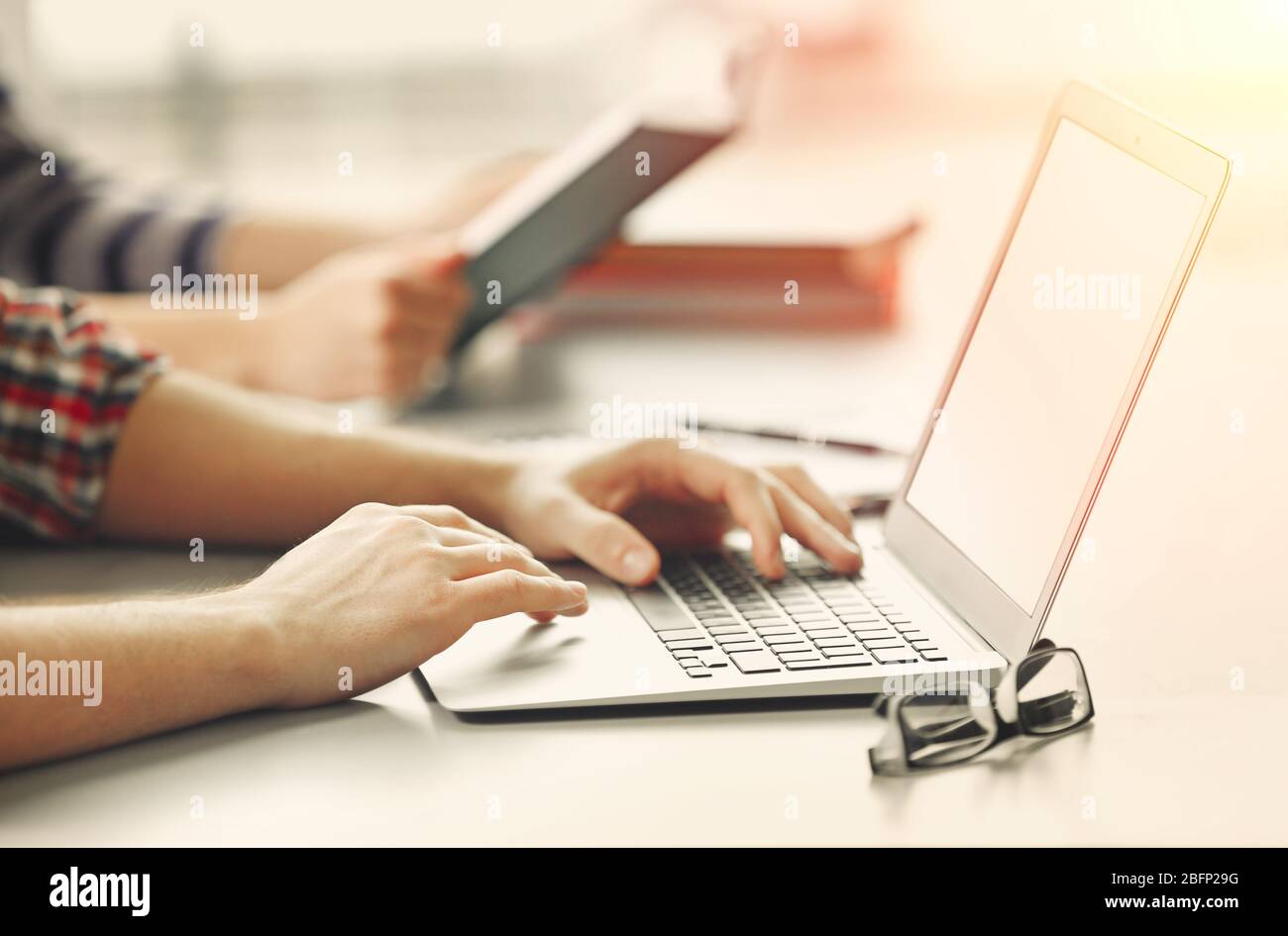 Student hands using laptop Stock Photo - Alamy