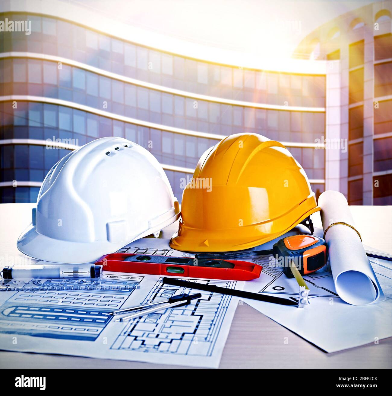 Table with construction drawings and other tools on business center ...