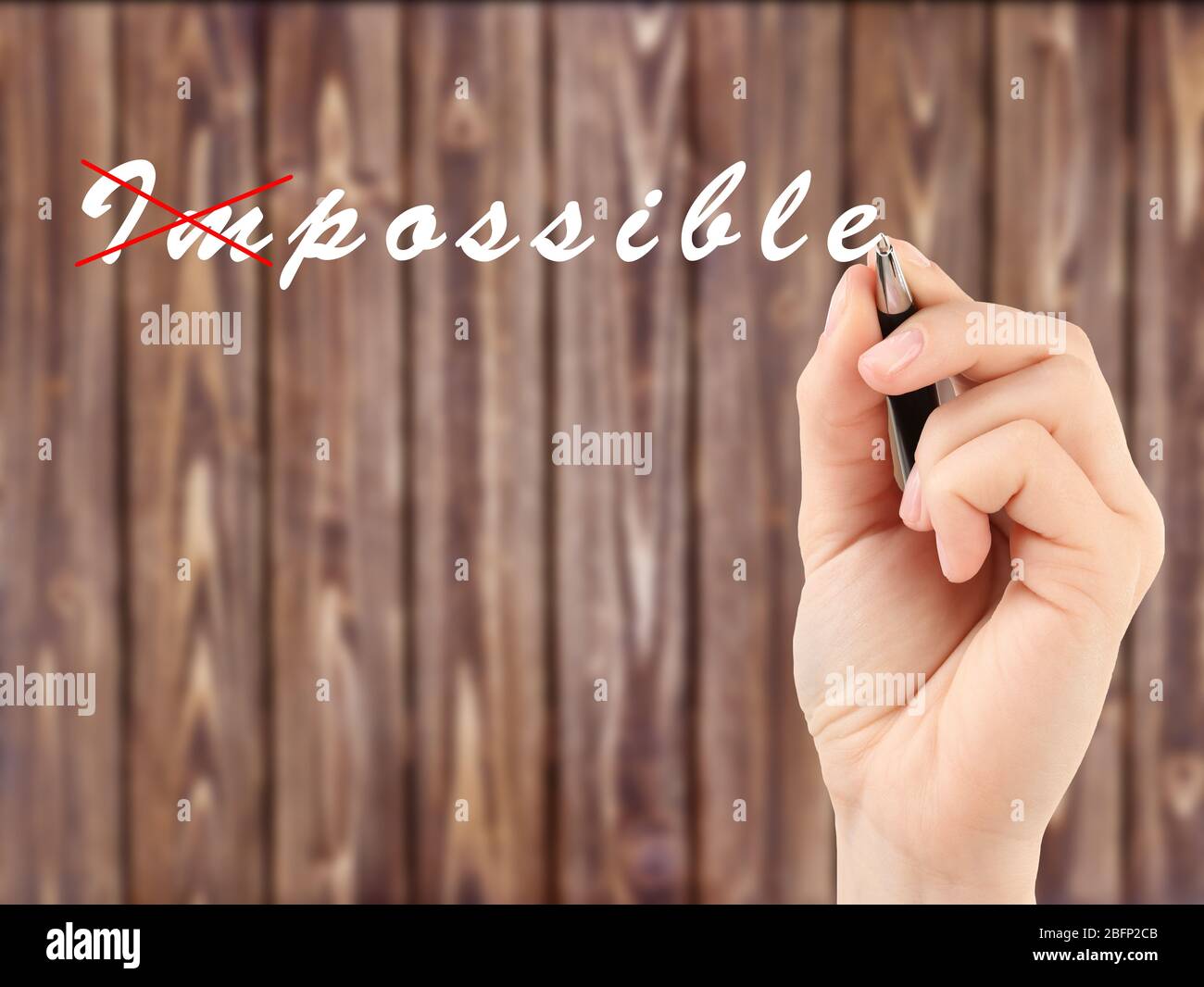 Human hand turning word impossible into possible Stock Photo - Alamy
