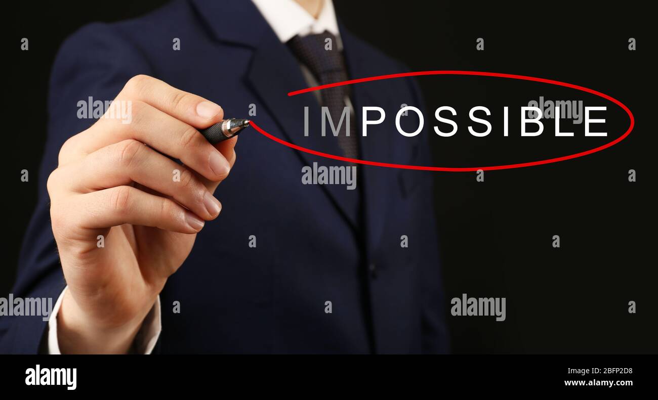 Human hand turning word impossible into possible Stock Photo - Alamy