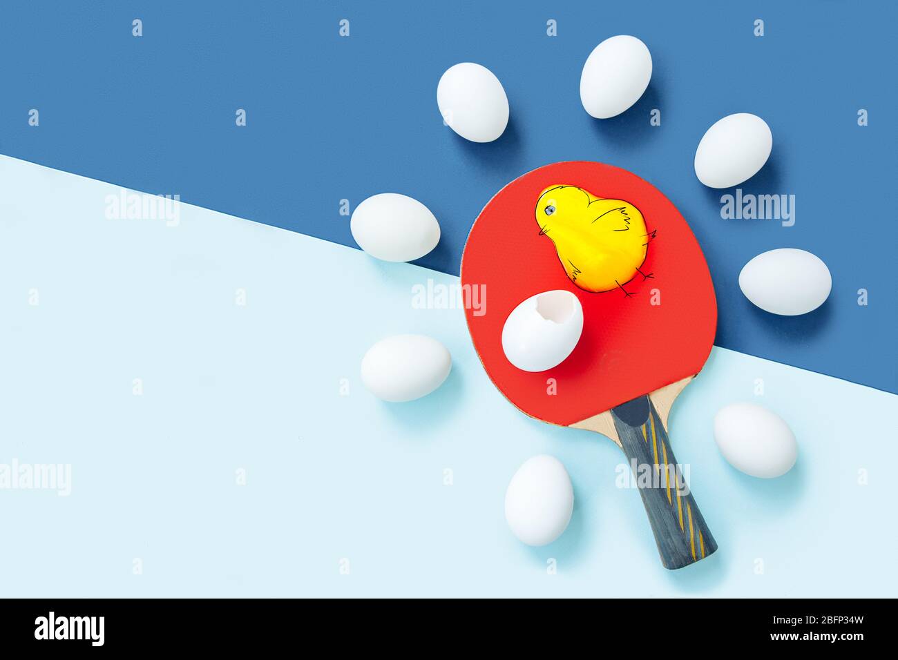 It could have been a chicken. A red table tennis racket is lying on ...