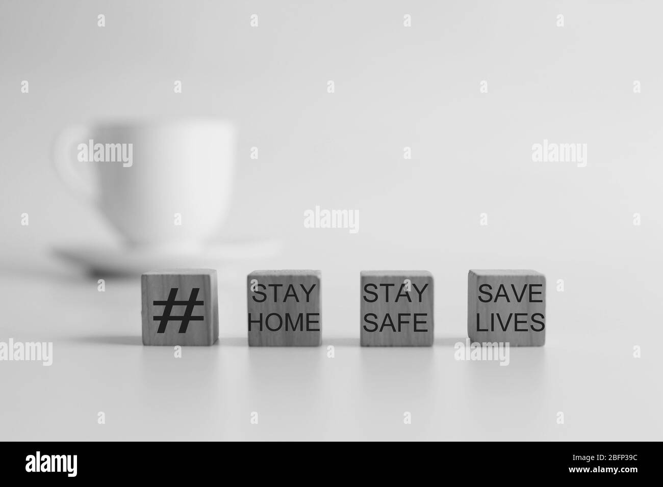 Concept image a wooden block and words STAY HOME, STAY SAFE, SAVE LIVES ...