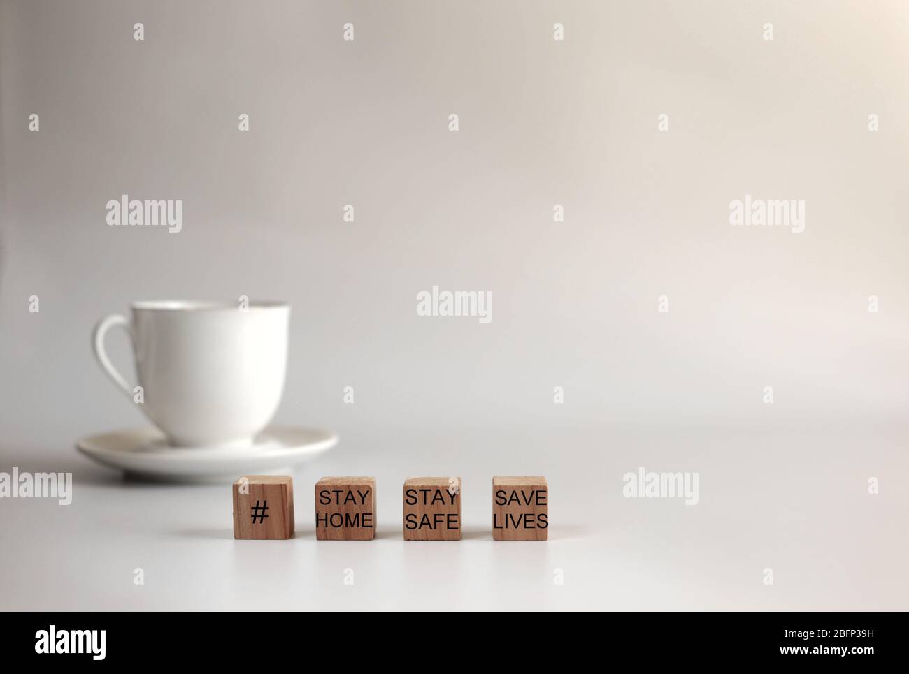 Concept image a wooden block and words STAY HOME, STAY SAFE, SAVE LIVES ...