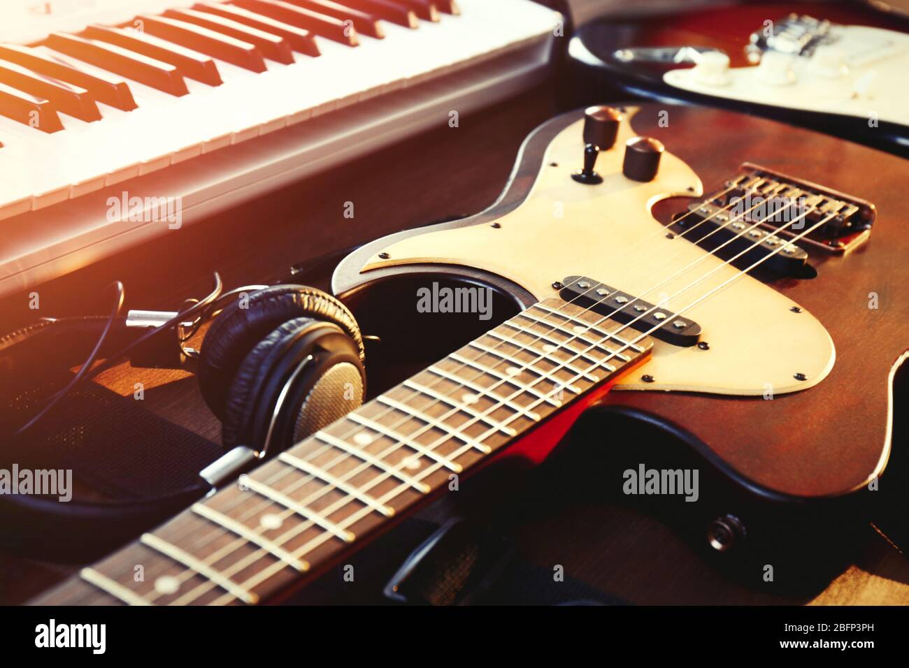 Electric guitar and synthesizer with light effect Stock Photo - Alamy