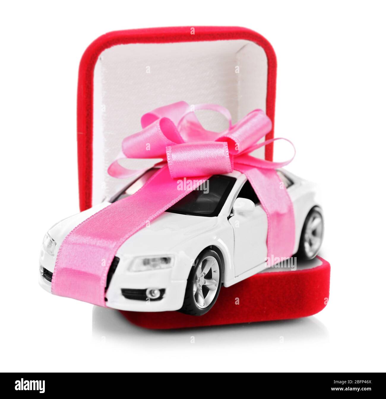 New car with pink bow as present in red jewelry box isolated on white ...