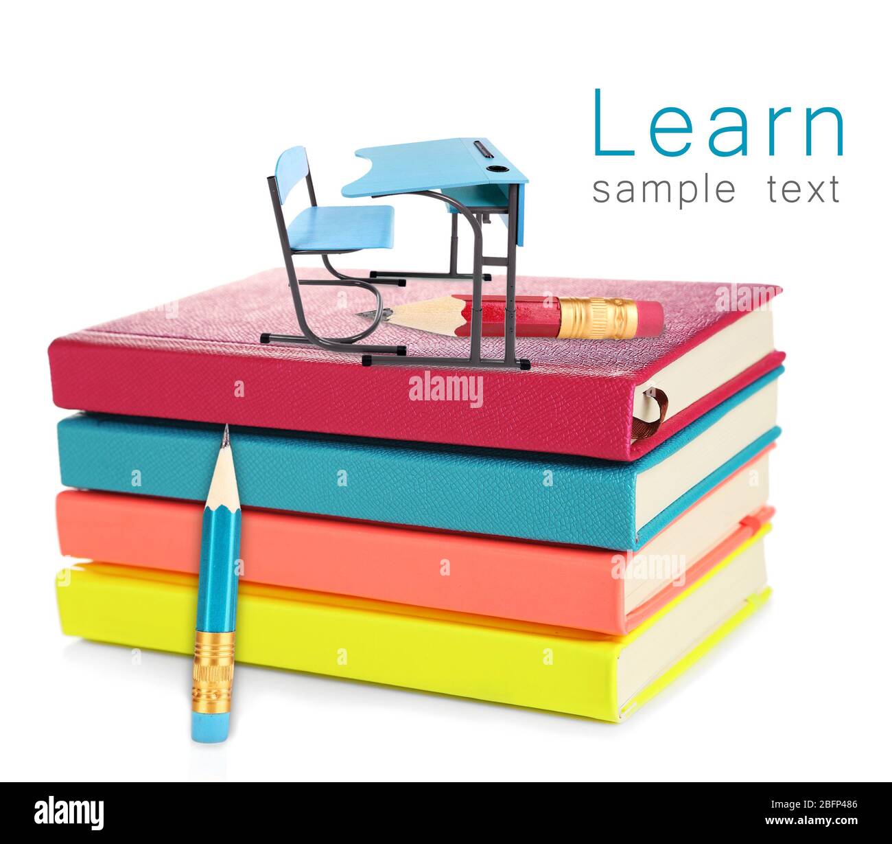 Little wooden desk and chair on colorful notebooks with pencils ... Little wooden desk and chair on colorful notebooks with pencils ...