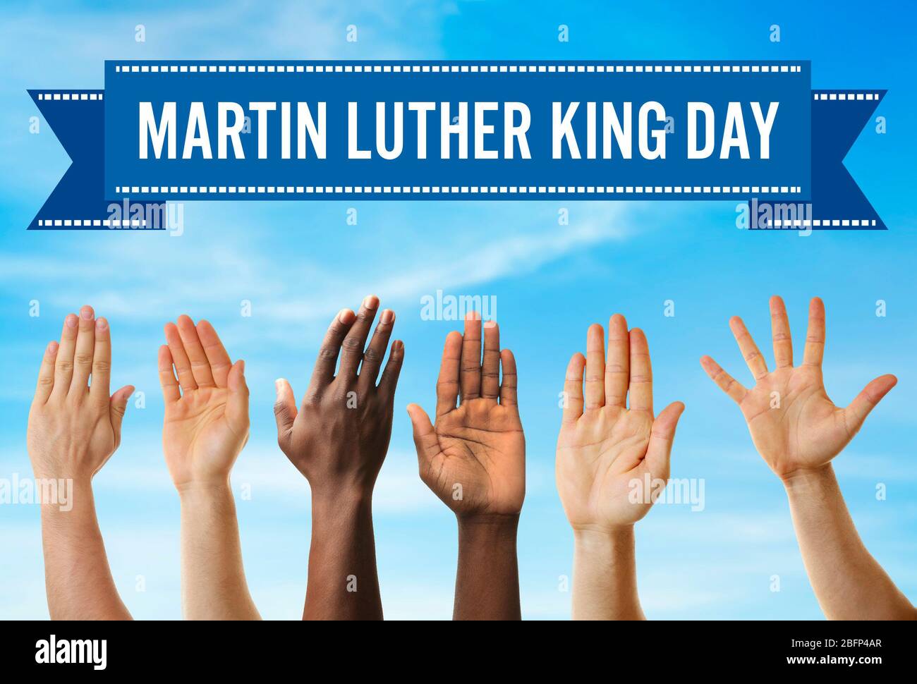 Martin Luther King Day. Different hands on blue sky background Stock ...
