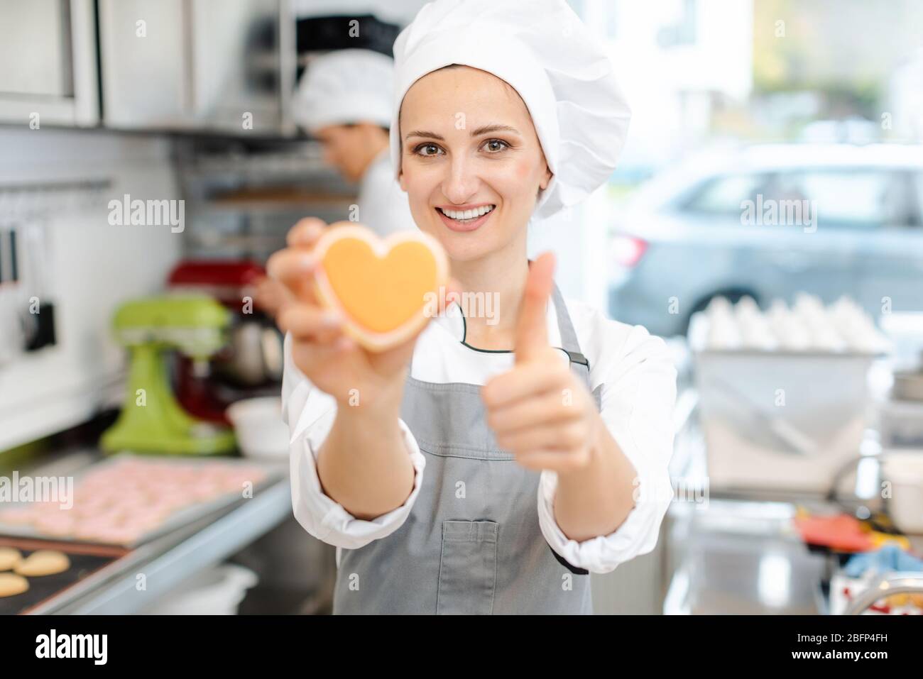 Pastry chef baking heart shaped cookies Stock Photo - Alamy