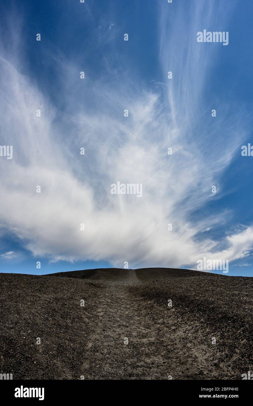 Wispy Clouds Above Volcanic Trail in Craters of the Moon Stock Photo ...