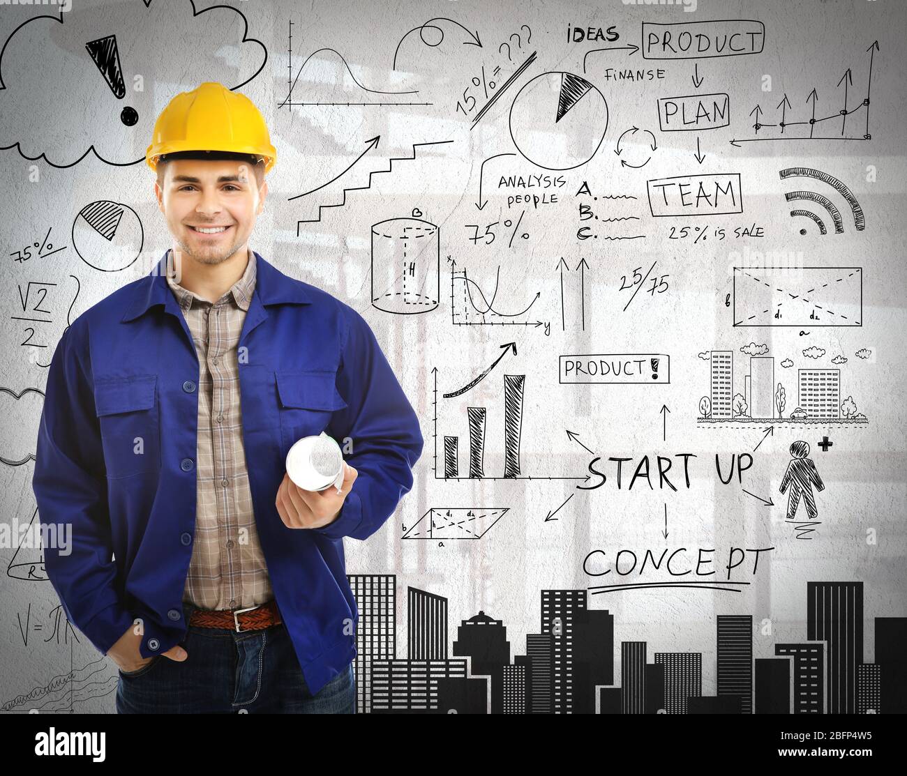 Engineer with blueprints and helmet on wall background Stock Photo - Alamy