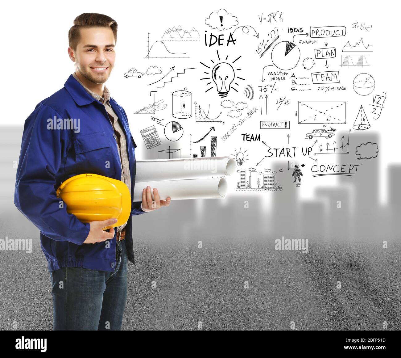 Engineer with blueprints and helmet on wall background Stock Photo - Alamy