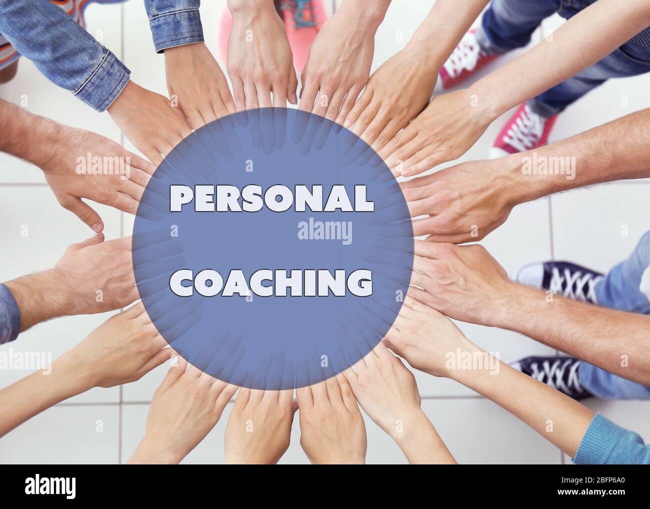 Personal coaching concept. United hands, top view Stock Photo - Alamy