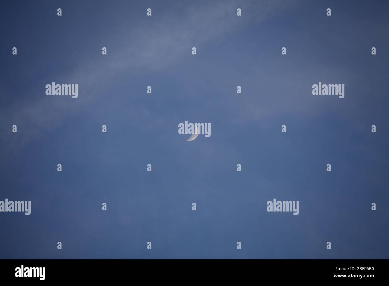 Daylight crescent moon Stock Photo - Alamy