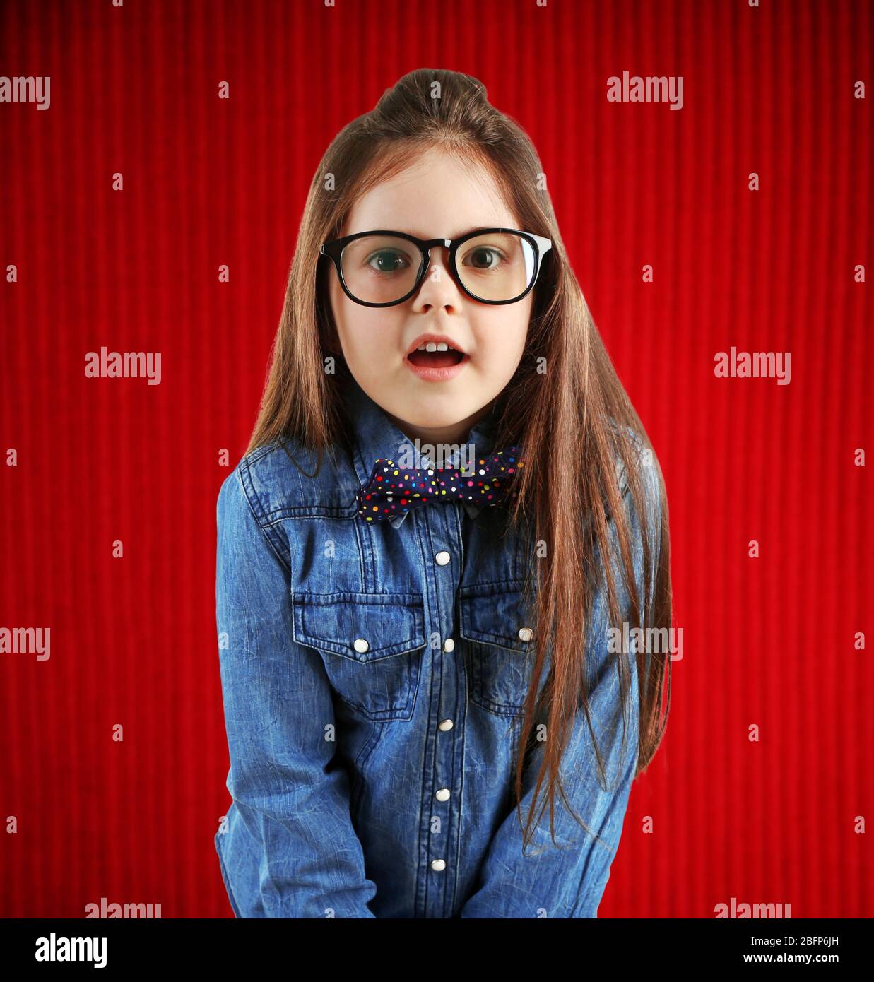 Cute girl wearing glasses on red background. Education concept Stock ...