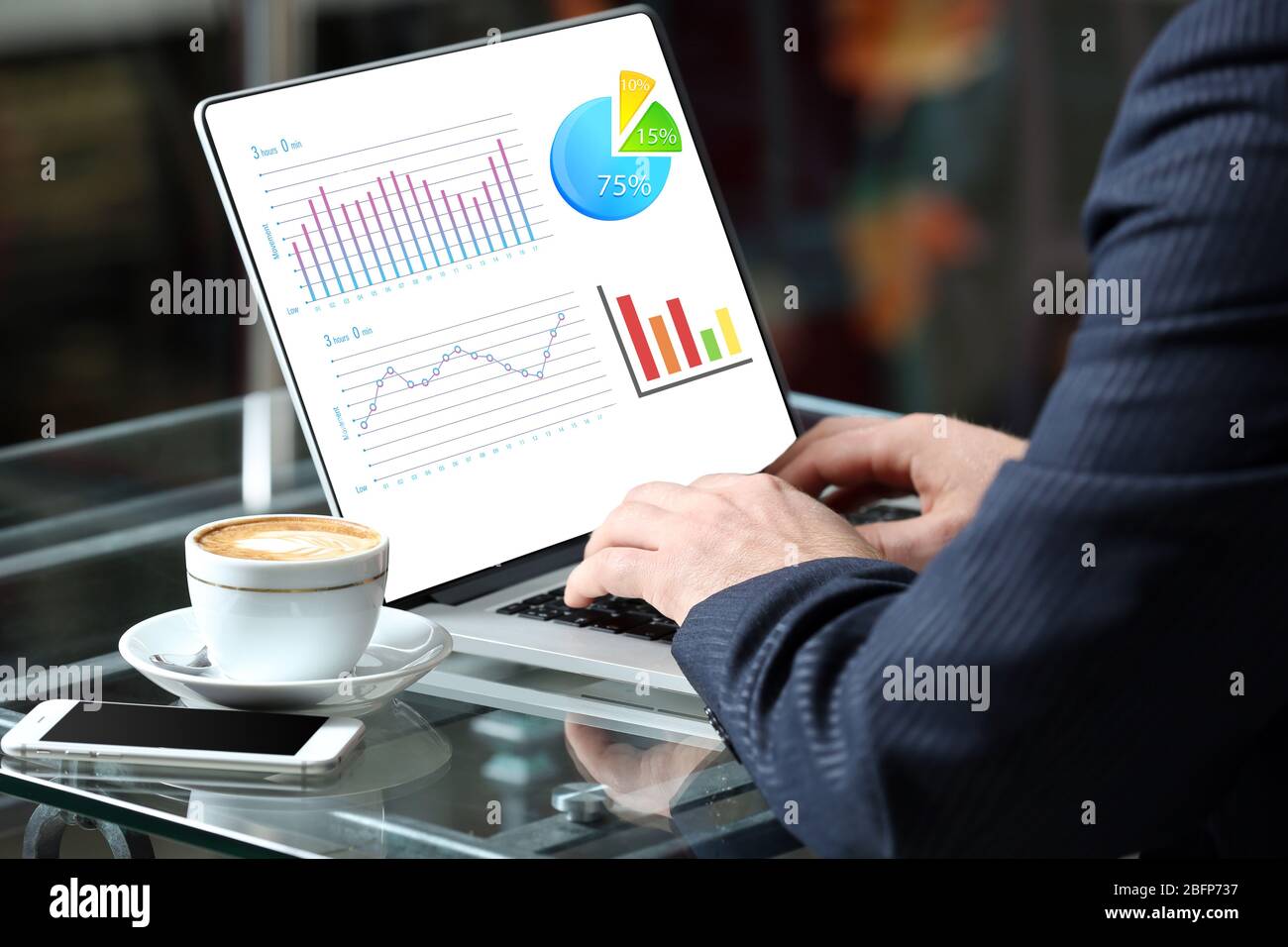 Businessman working with laptop. Analysis graph and diagram on screen ...