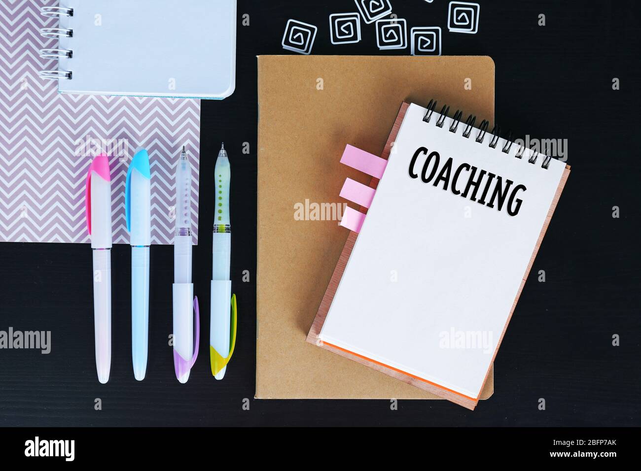 Office set with stationery and notebooks on a table. Coaching concept ...