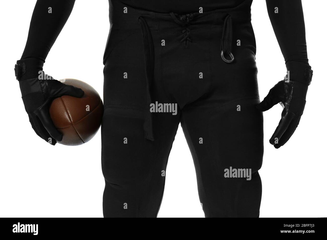 American footballer holding ball hi-res stock photography and images ...