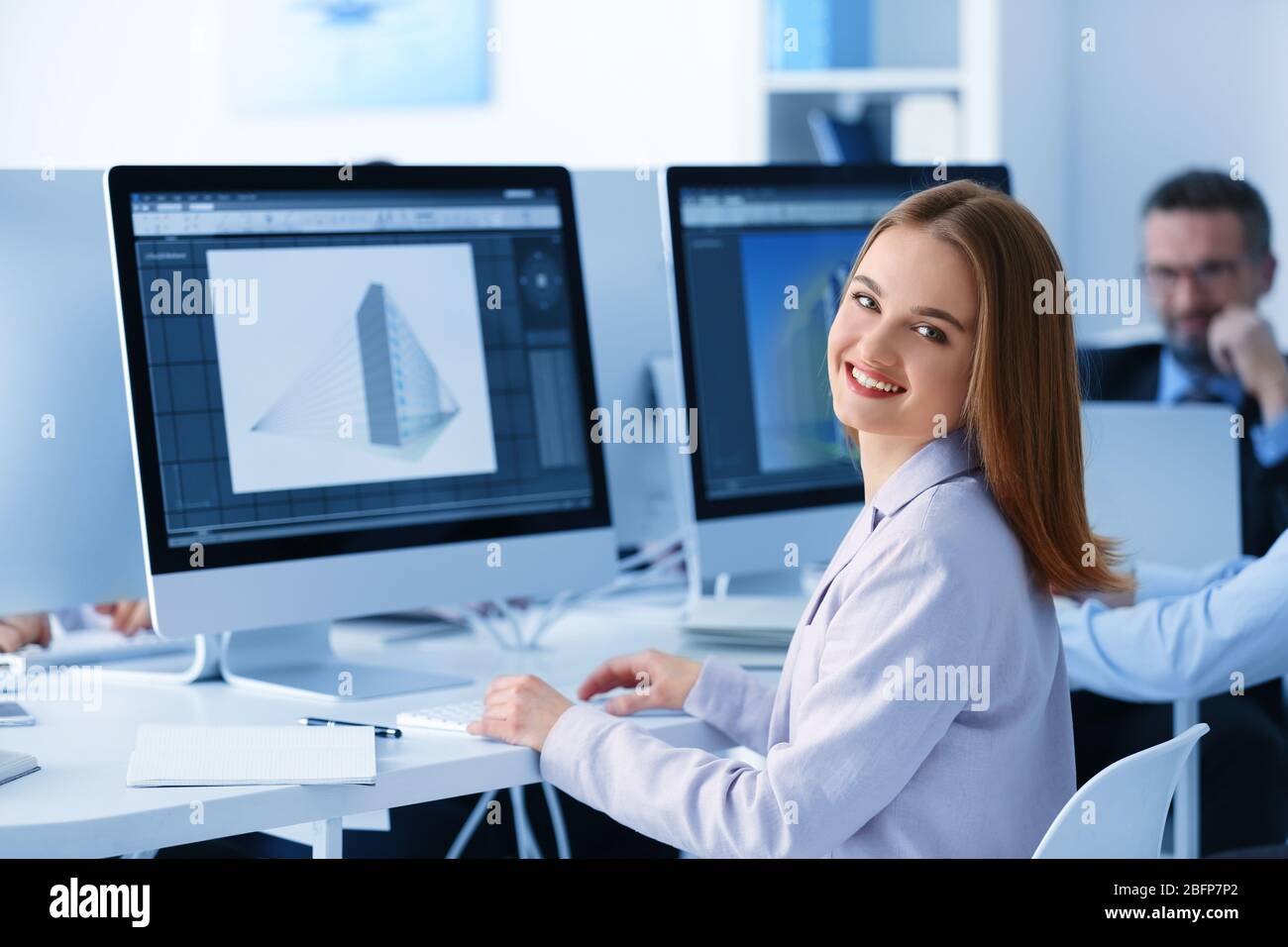 Young female engineer working in the office Stock Photo - Alamy