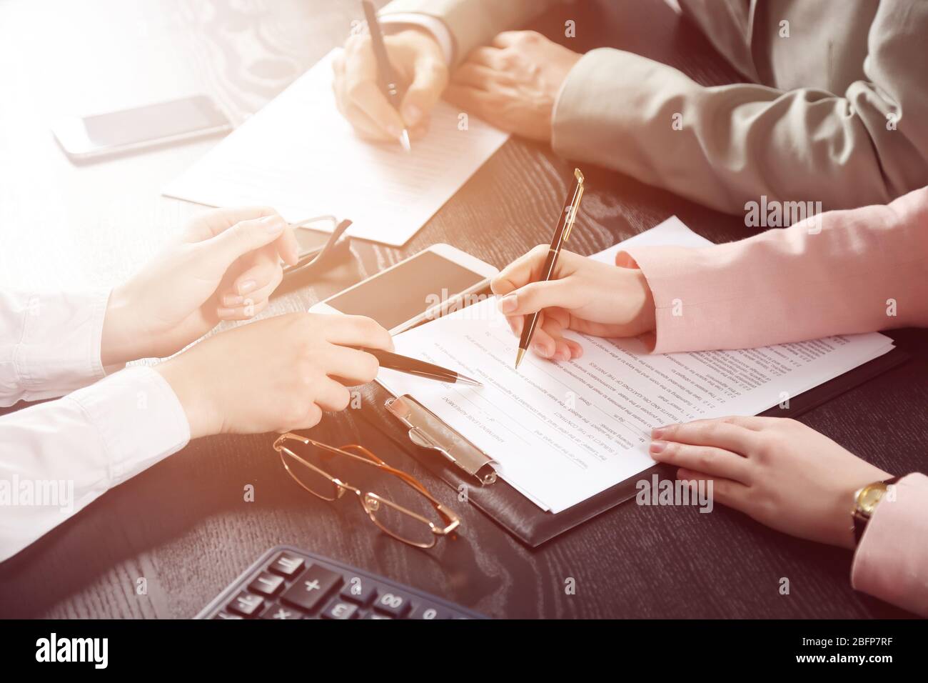 Human hands working with documents at the desk closeup Stock Photo - Alamy