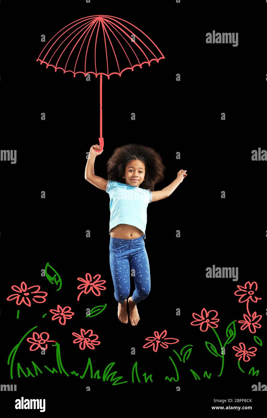 Happy African girl jumping on black background Stock Photo - Alamy