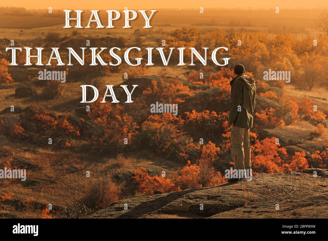 Happy Thanksgiving Day. Man on the top of the mountain Stock Photo - Alamy