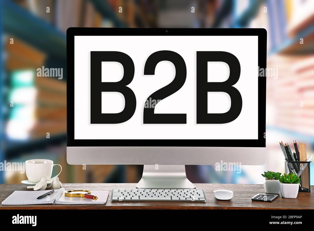 B2B business to business concept. Modern computer on table in library ...