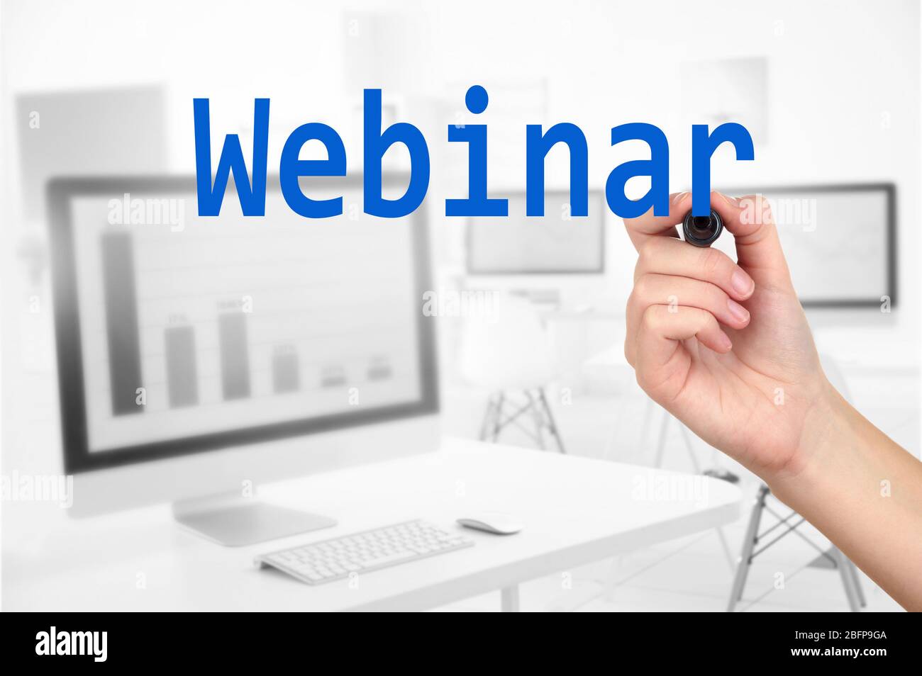 Human hand writing word WEBINAR at transparent whiteboard on conference ...