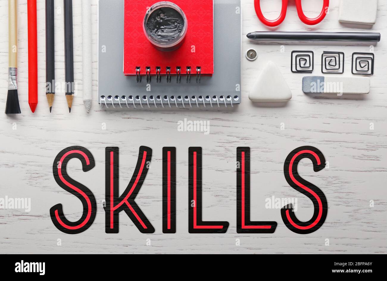 Skills. Office supplies on light wooden background Stock Photo - Alamy