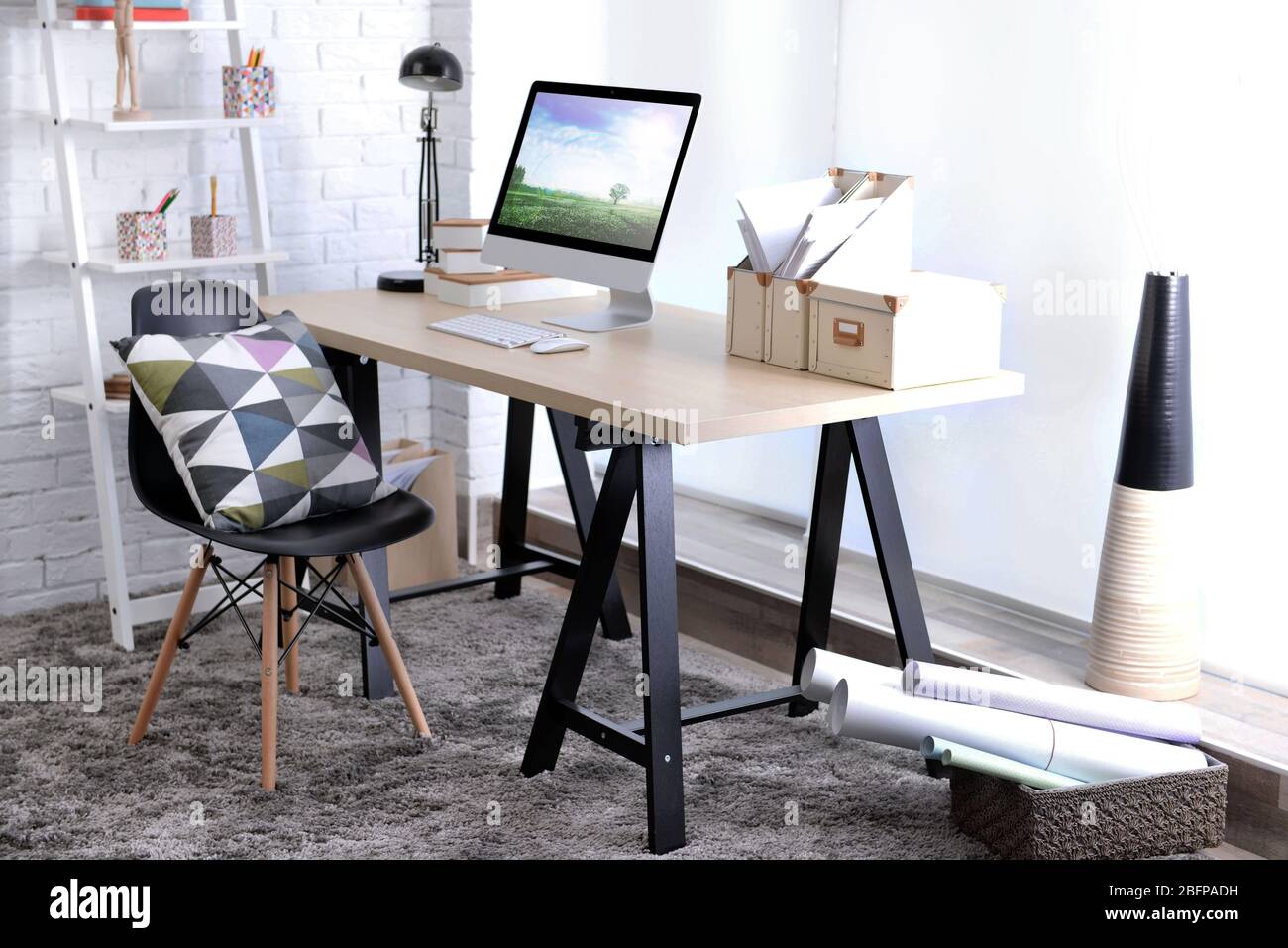 Comfortable workplace with modern computer and summer landscape on ...