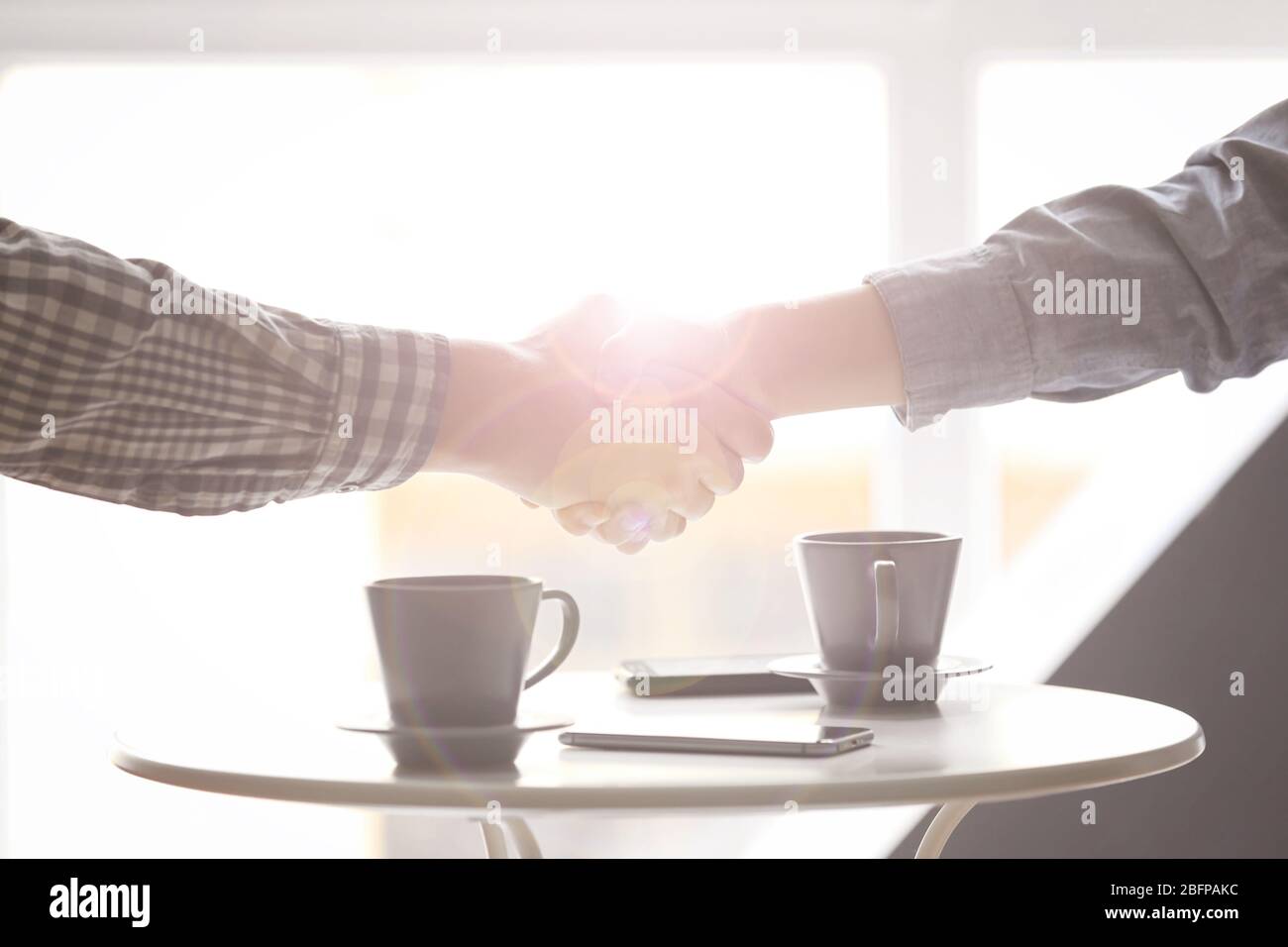 Business people handshaking Stock Photo - Alamy
