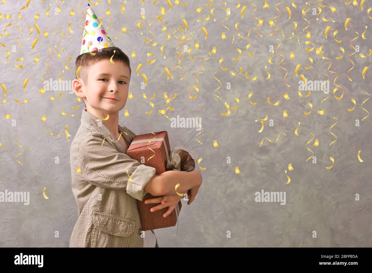 Little boy with gift box Stock Photo - Alamy