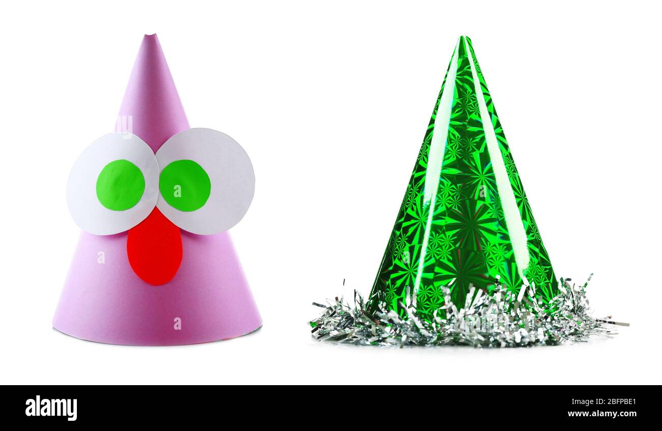 Colorful party caps on white background Stock Photo - Alamy