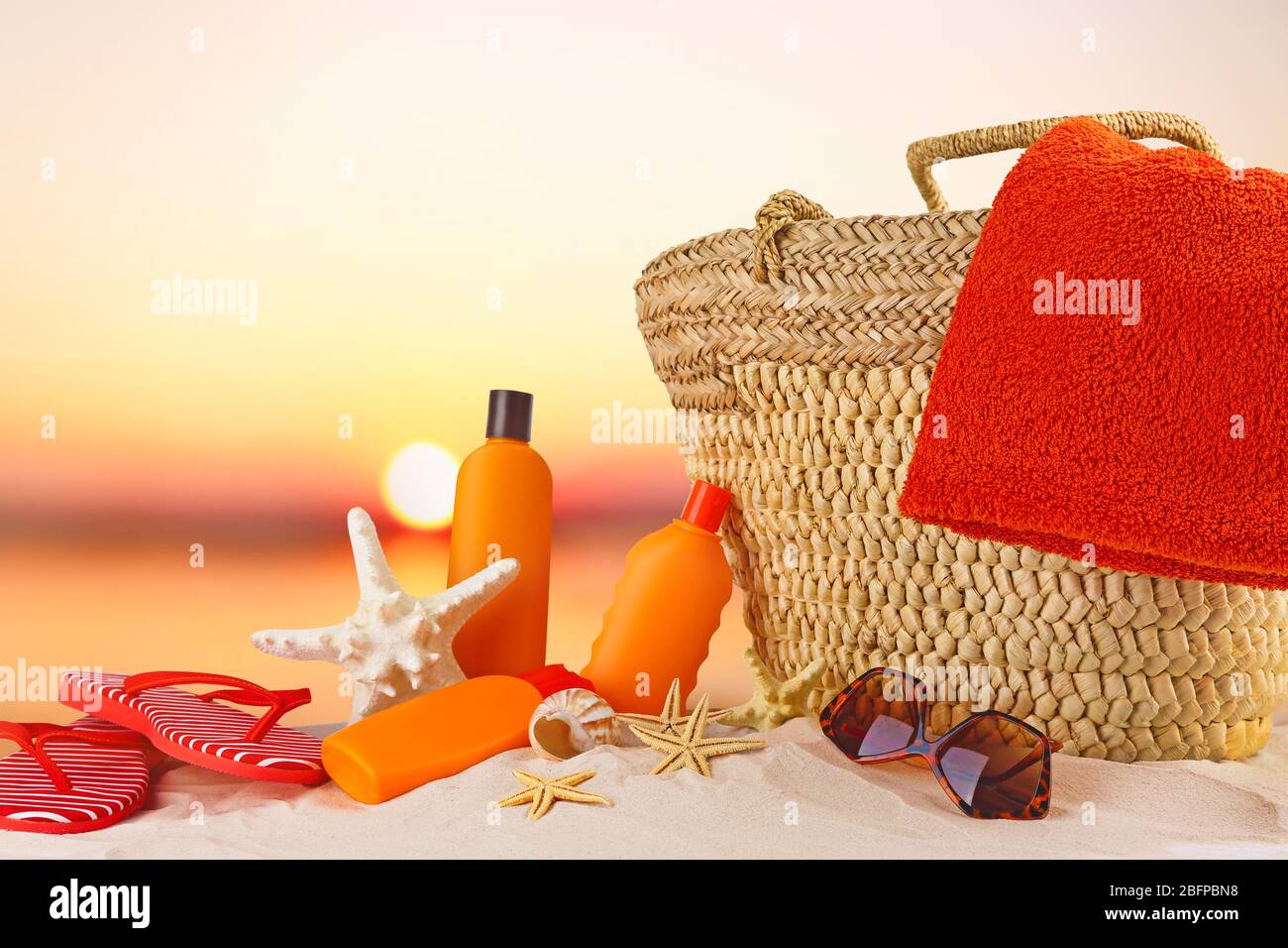 Sun protection set on sunset background Stock Photo - Alamy