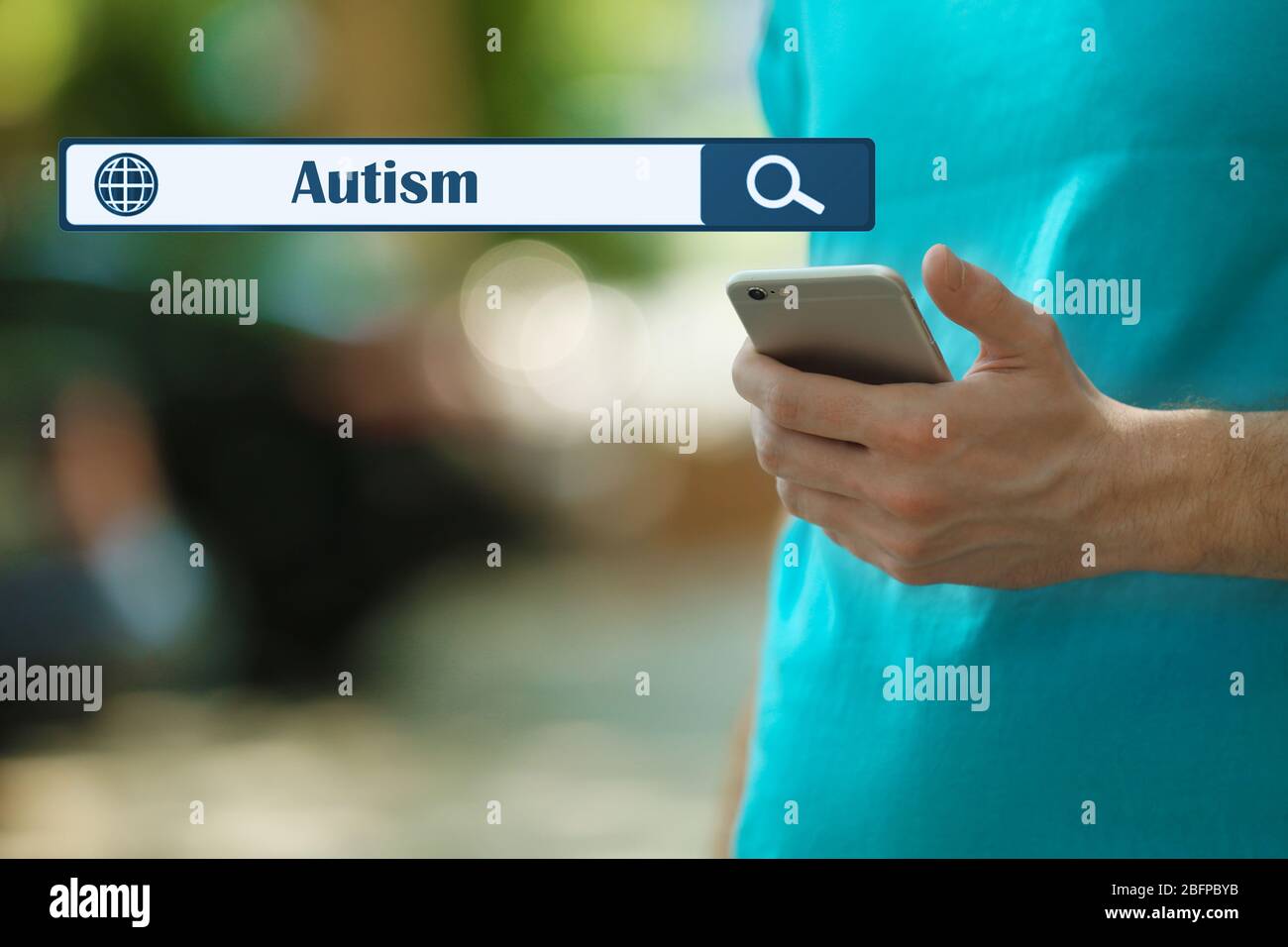 Man holding smart mobile phone outdoors. Children autism concept Stock ...