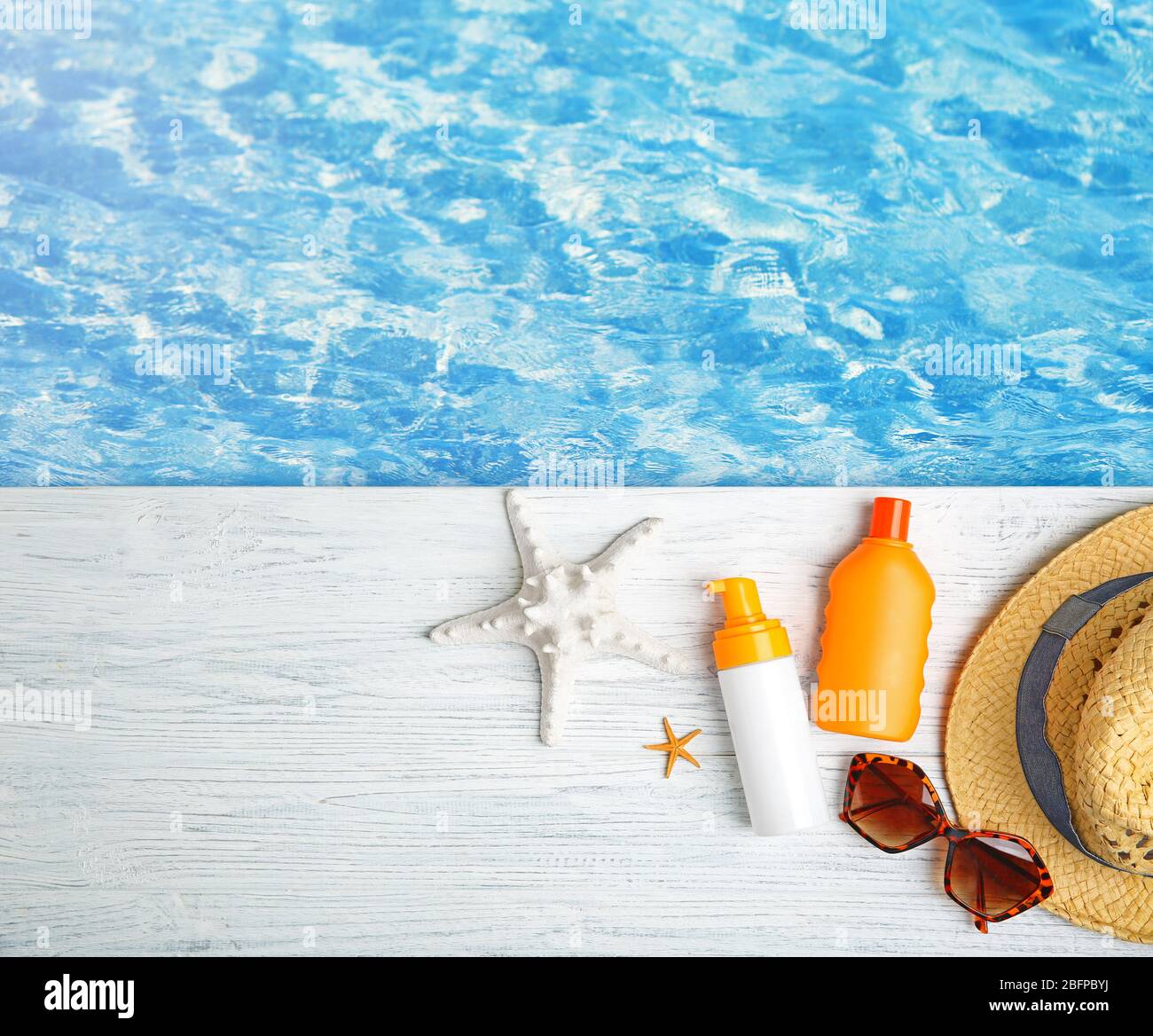 Summer beach set on swimming pool water background Stock Photo - Alamy