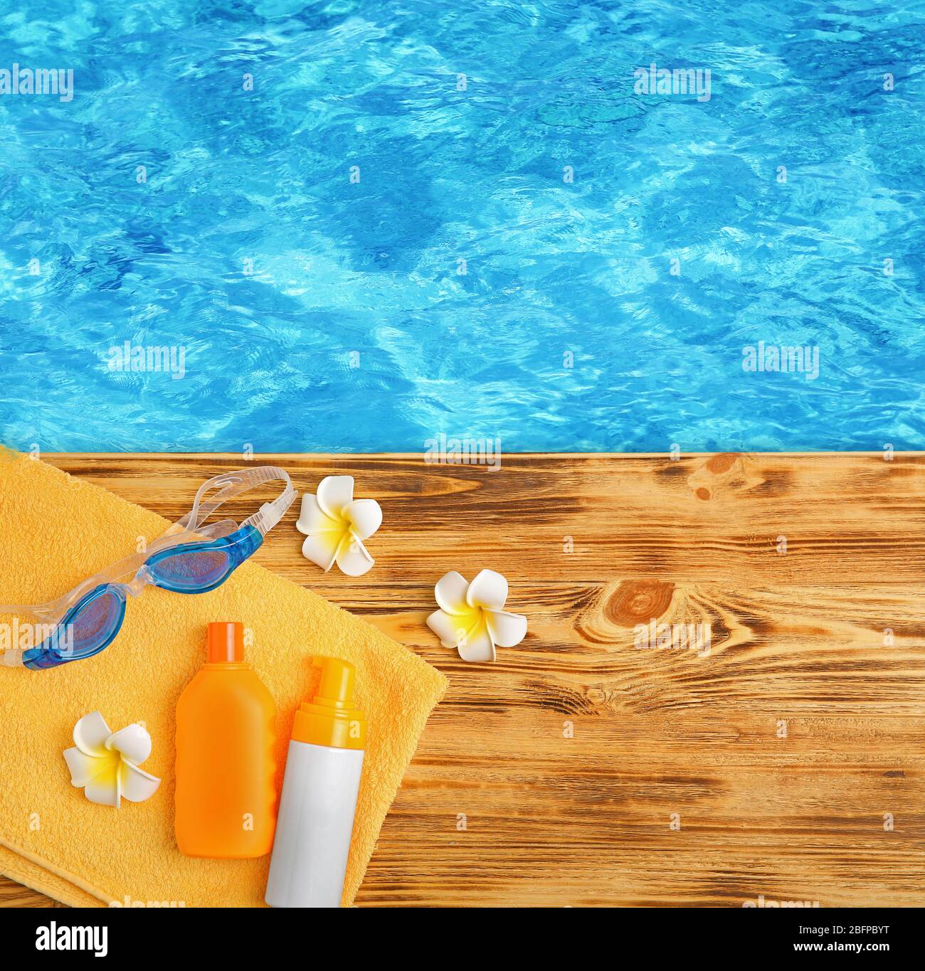 Summer beach set on swimming pool water background Stock Photo - Alamy