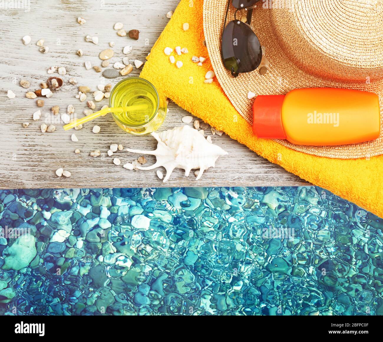 Summer beach set on swimming pool water background Stock Photo - Alamy