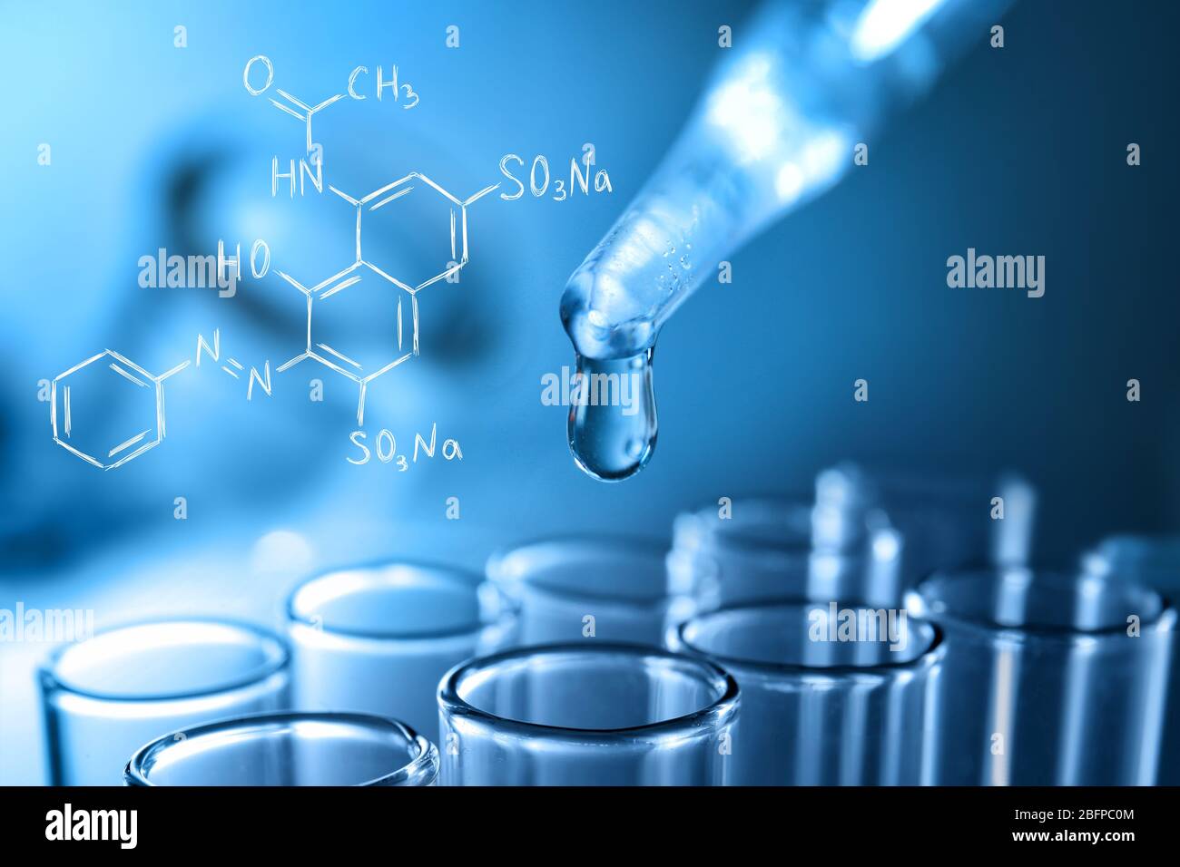 Pipette and test tube with liquid, closeup. Pharmaceutical research and ...
