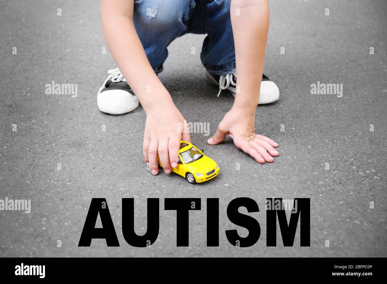 Children autism concept. Little boy playing with toy car outdoor Stock ...