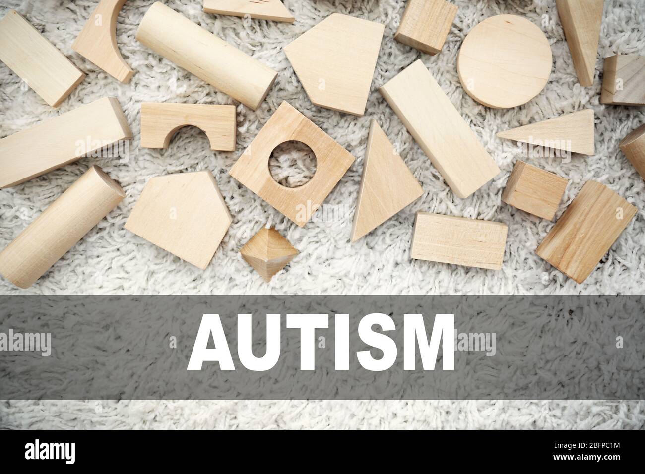 Children autism concept. Wooden children's building blocks on carpet ...