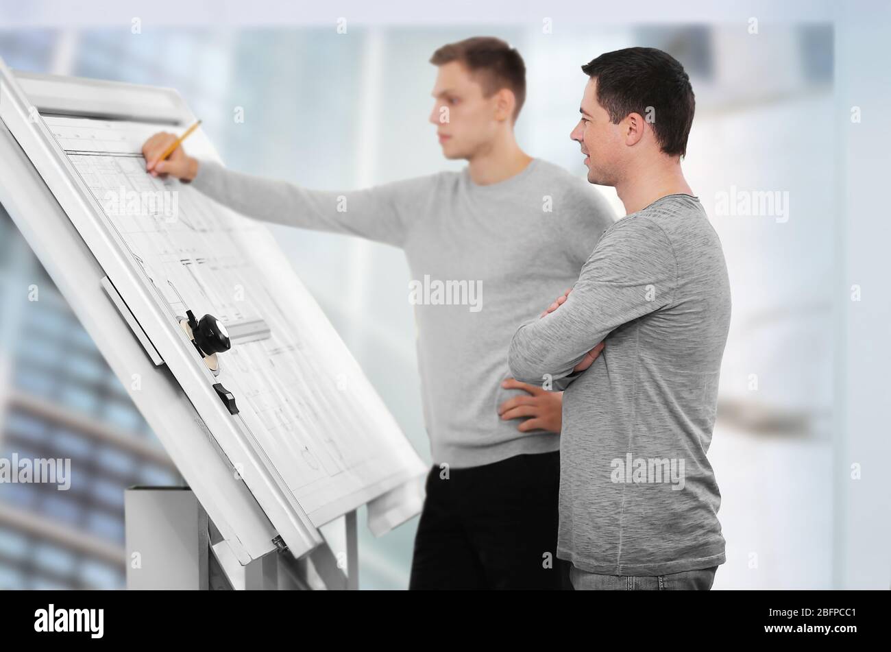 Team of young creative engineers working with new architectural project ...