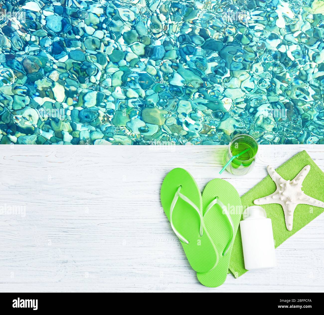 Summer beach set on swimming pool water background Stock Photo - Alamy